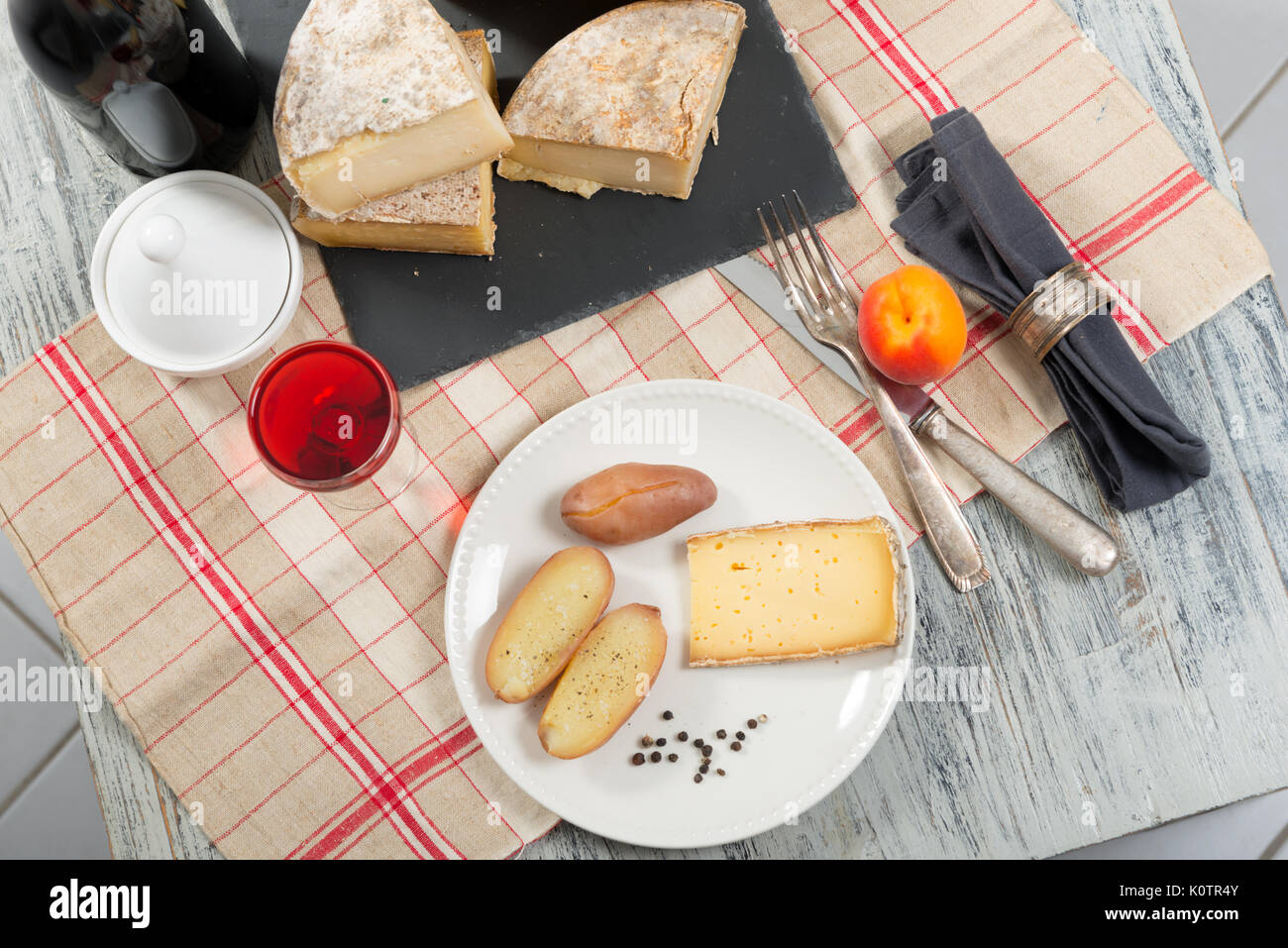 Different french cheeses with a glass of red wine Stock Photo - Alamy