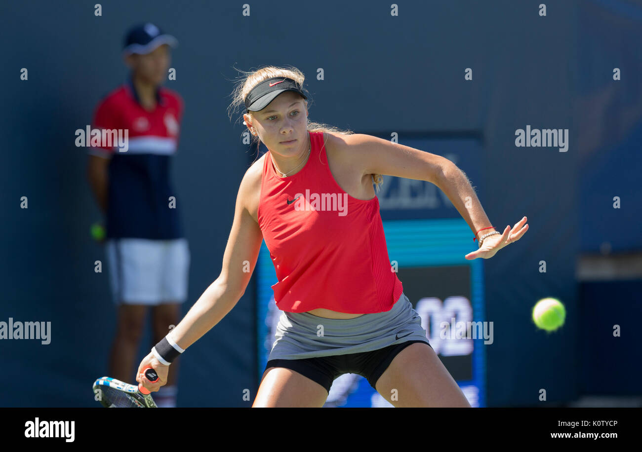 New York, USA. 23rd Aug, 2017. Amanda Anisimova of USA returns ball ...