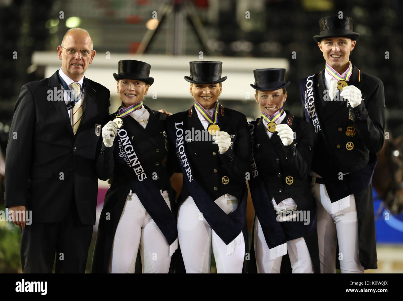 The German dressage team with Sonke Rothenberger (right to left), Helen ...