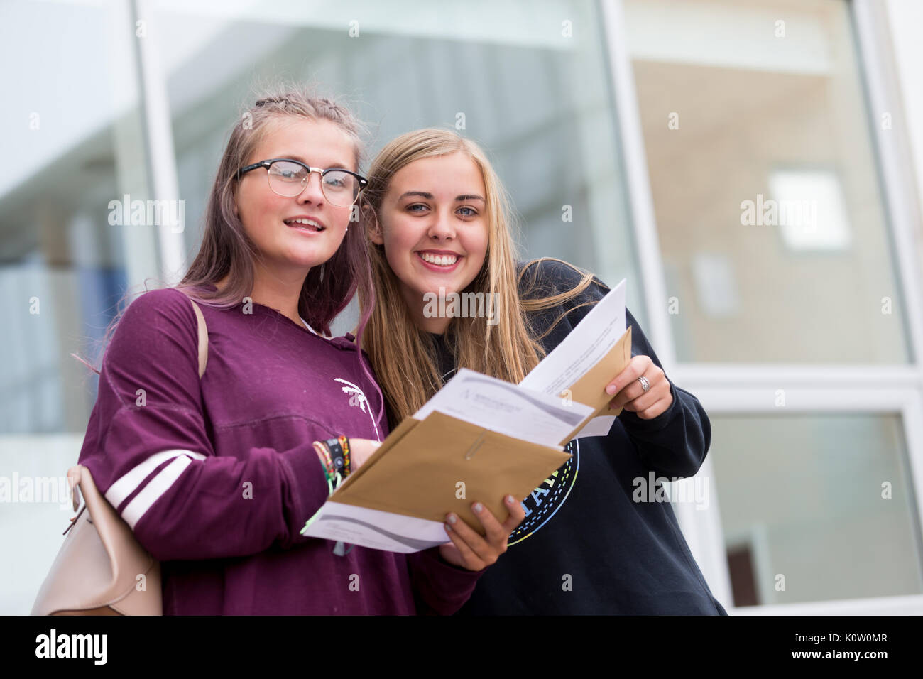 Two girls teenagers opening their GCSE examination exam results UK ...