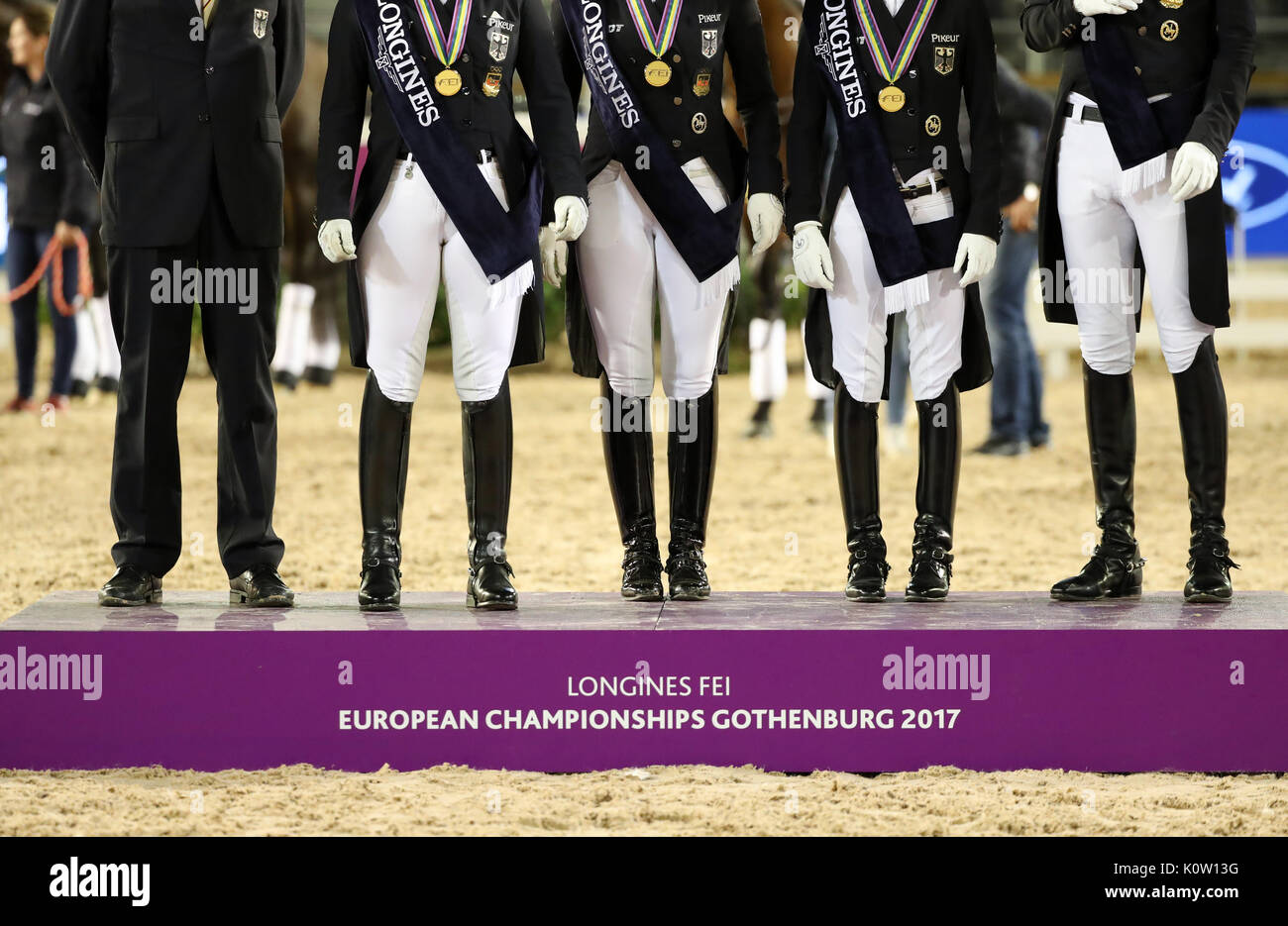 dpatop - The legs of Klaus Roeser (left to right), team coach of the ...