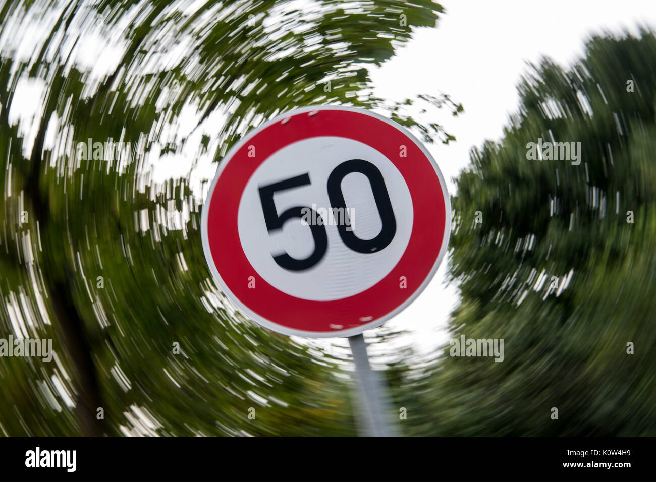 A traffic sign indicating a speed limit of 50 km/h seen near Tubingen ...