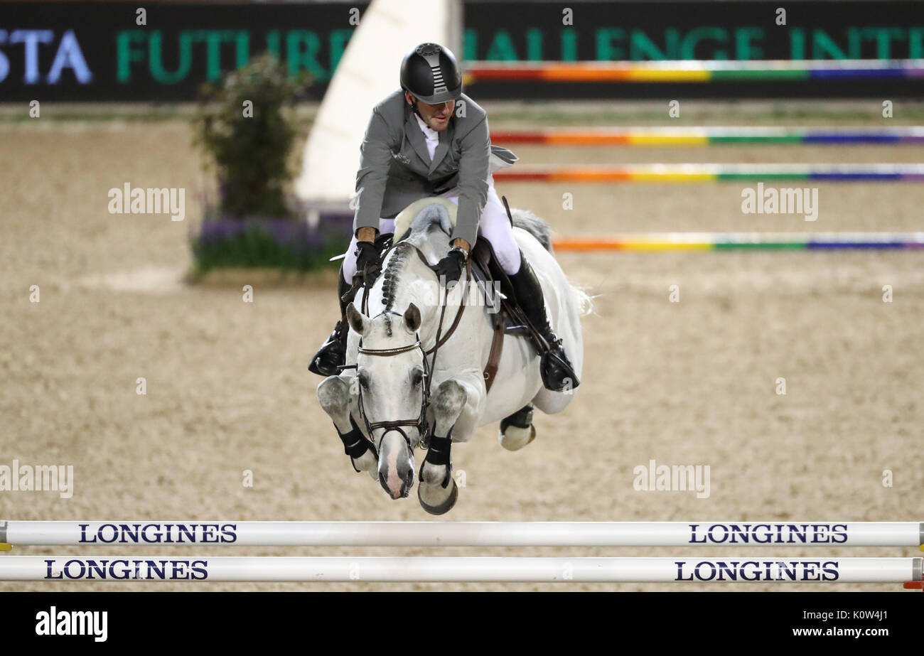 German show jumper Philipp Weishaupt on his horse Carvagio riding ...