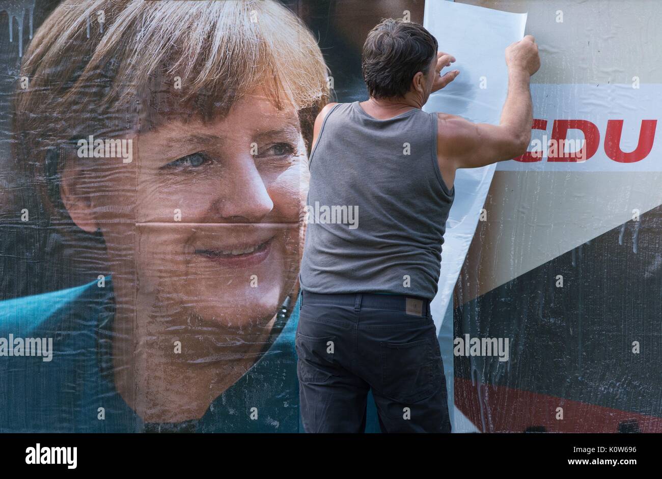 Pasting poster hi-res stock photography and images - Alamy