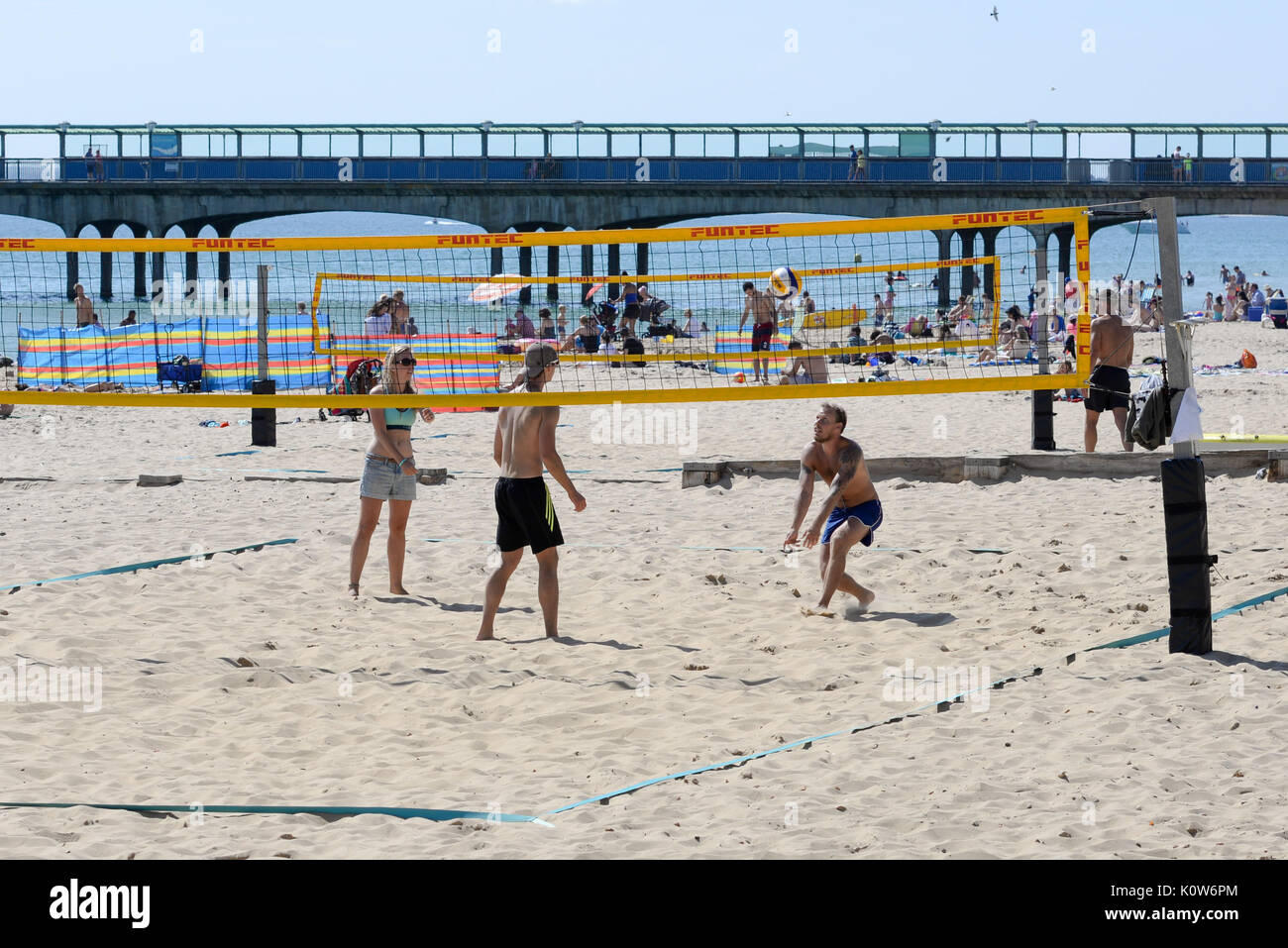 Playing Beach volleyball for fun on Boscombe Beach, Bournemouth, Dorset ...