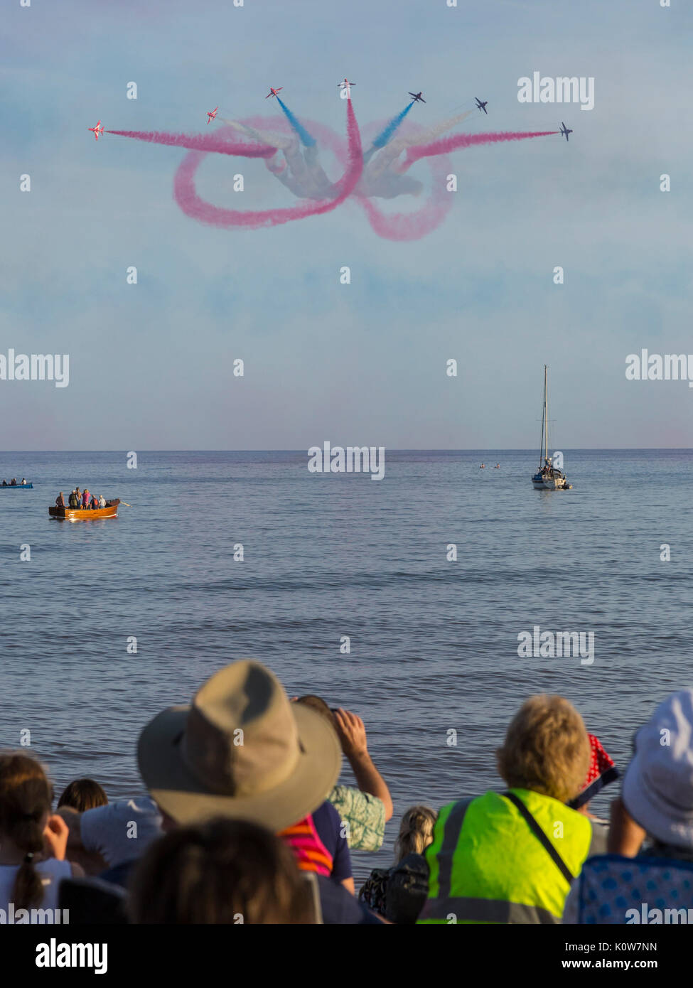 Crowds pack the beach on a glorious evening for the Red Arrows display ...