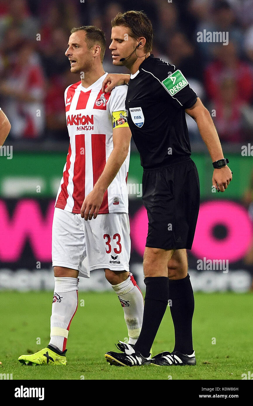 Injured referee Felix Brych (R) needs the help of Cologne's Matthias ...