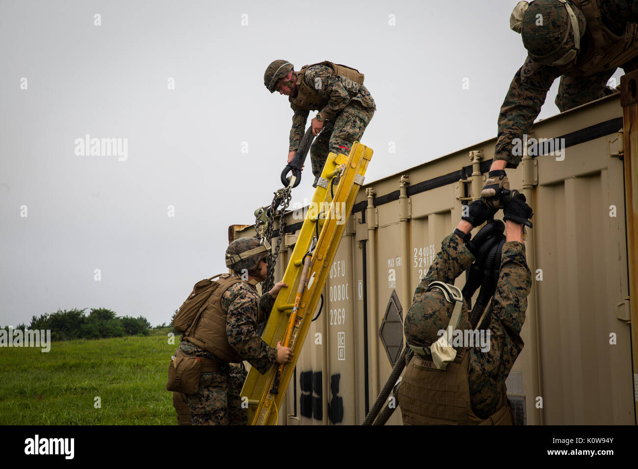 Landing support specialist Marines prepare slings during external lift ...