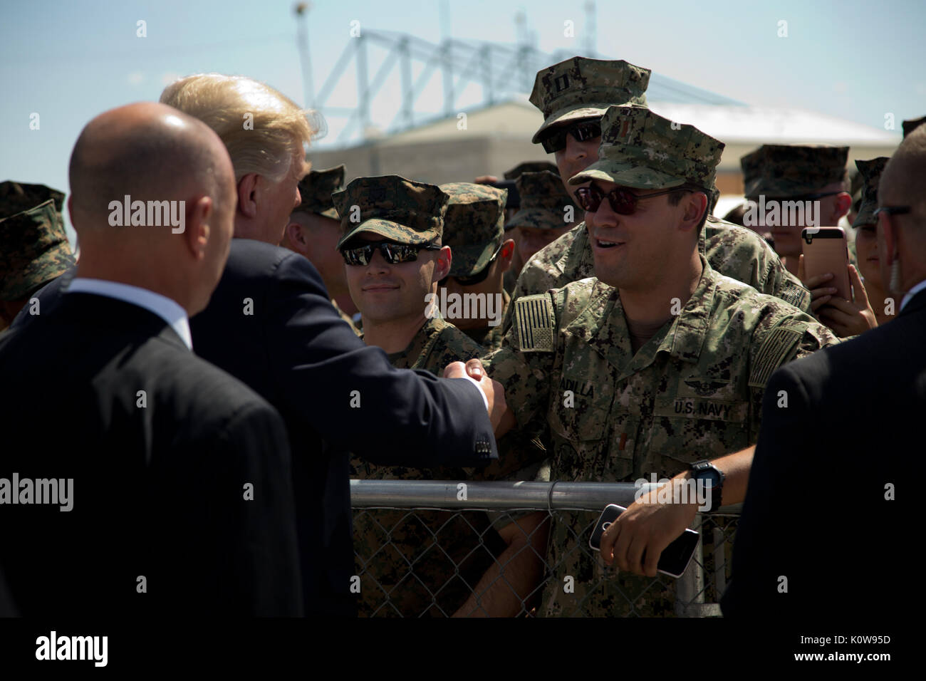 U.S. President Donald J. Trump shakes the hand of a U.S. Navy Sailor ...