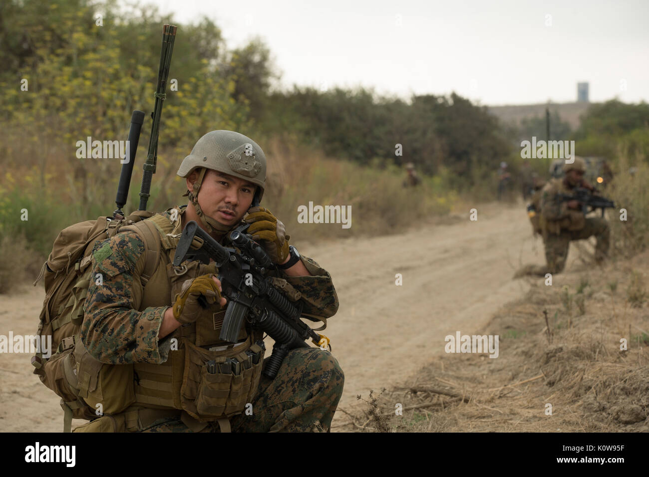 U.S. Marine Corps Sgt. David Sukatoya, a Fire Control Team chief, radio ...