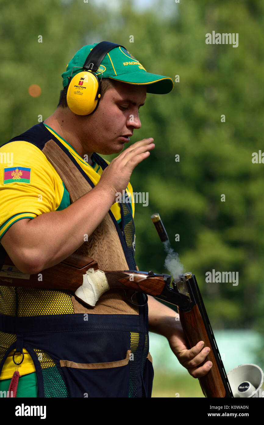 St. Petersburg, Russia - August 4, 2015: Dmitry Chernov with shotgun ...