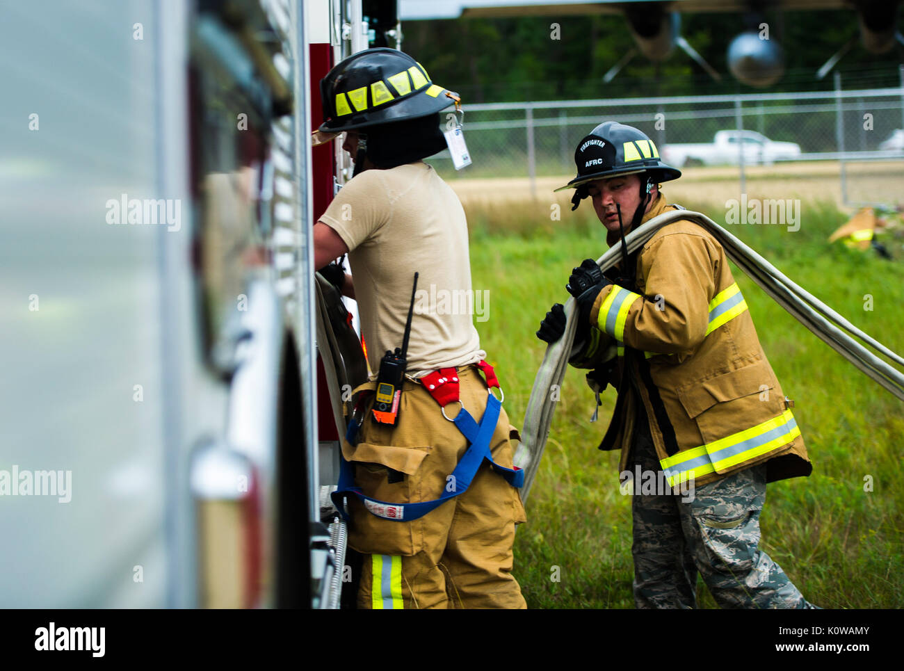 U.S. Air Force Senior Airman Dustin Lawrence,left , a firefighter with ...
