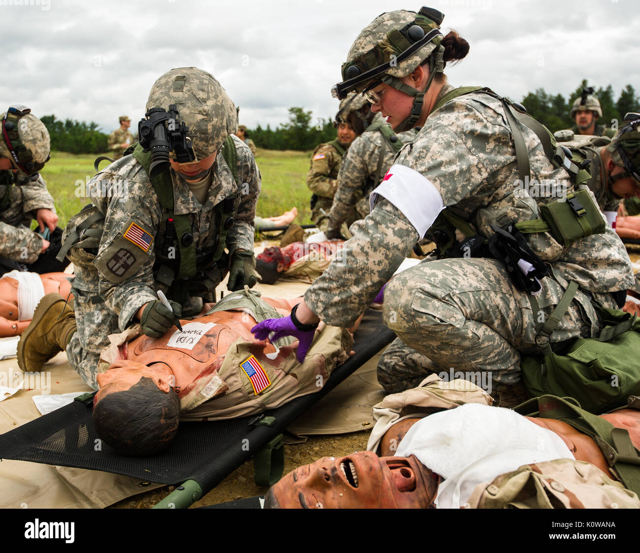 U.S. Army medics provide care to simulated wounded of a U.S. Air Force ...