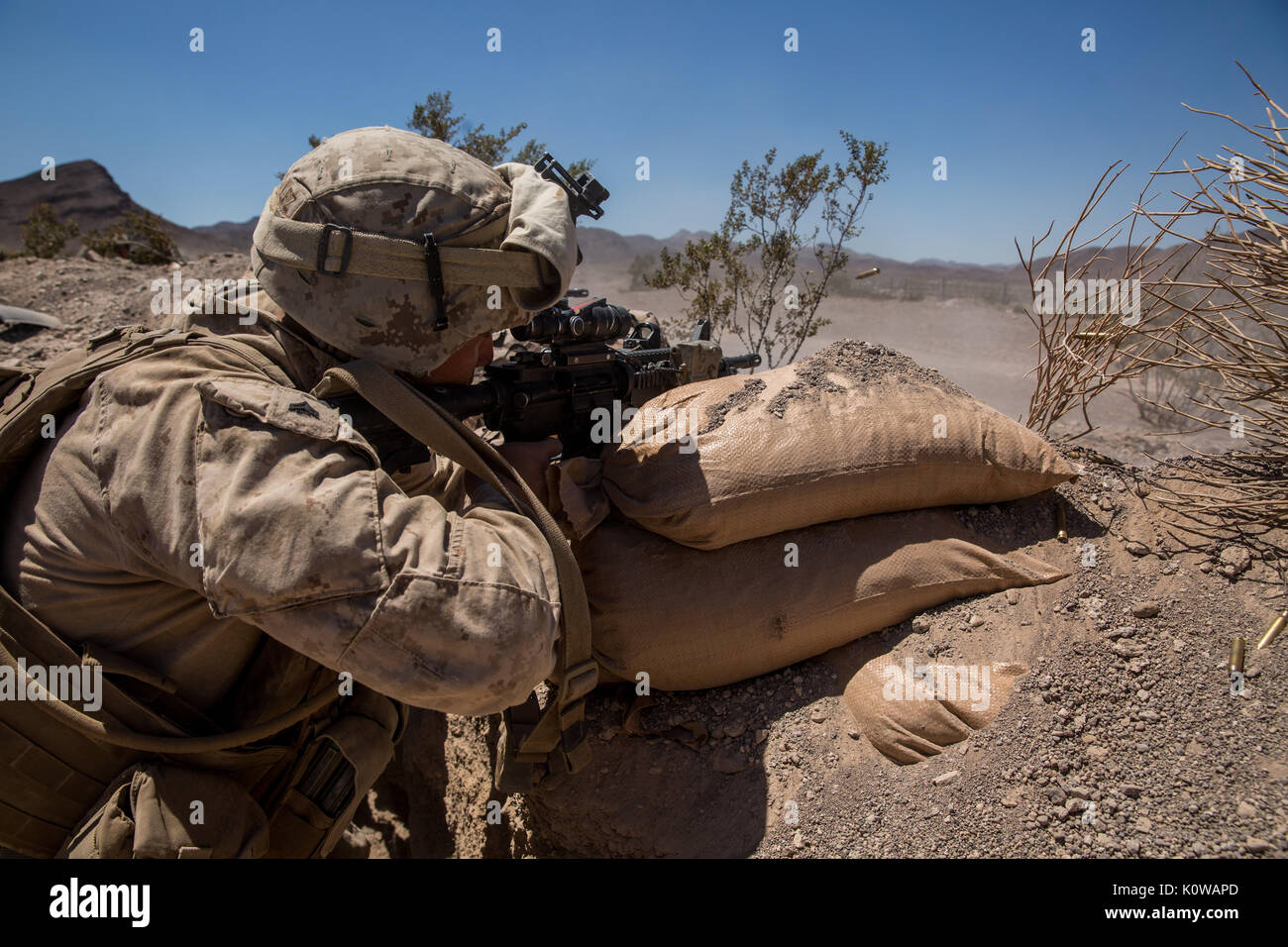 Marines use M240B medium machine guns to engage simulated targets ...
