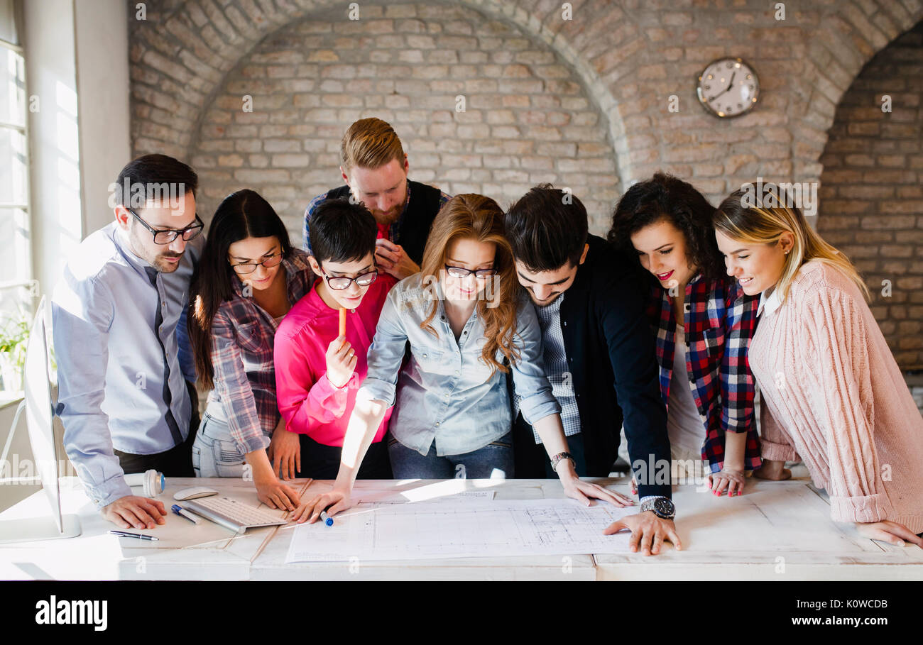 Portrait of young perspective designers having meeting Stock Photo - Alamy