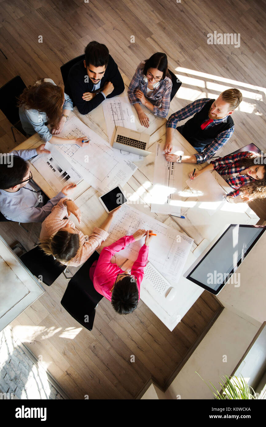 Portrait of young perspective designers having meeting Stock Photo - Alamy