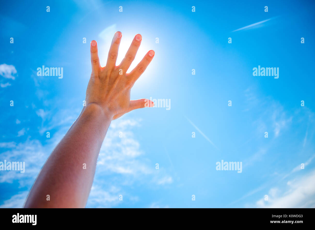 Silhouette of a Hand against a Sunset. Sun rays between fingers. Summer ...