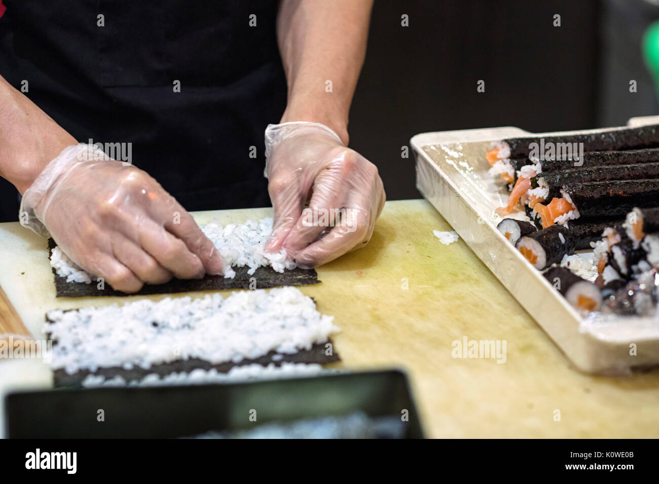 Creating sushi in Japanese restaurant Stock Photo - Alamy