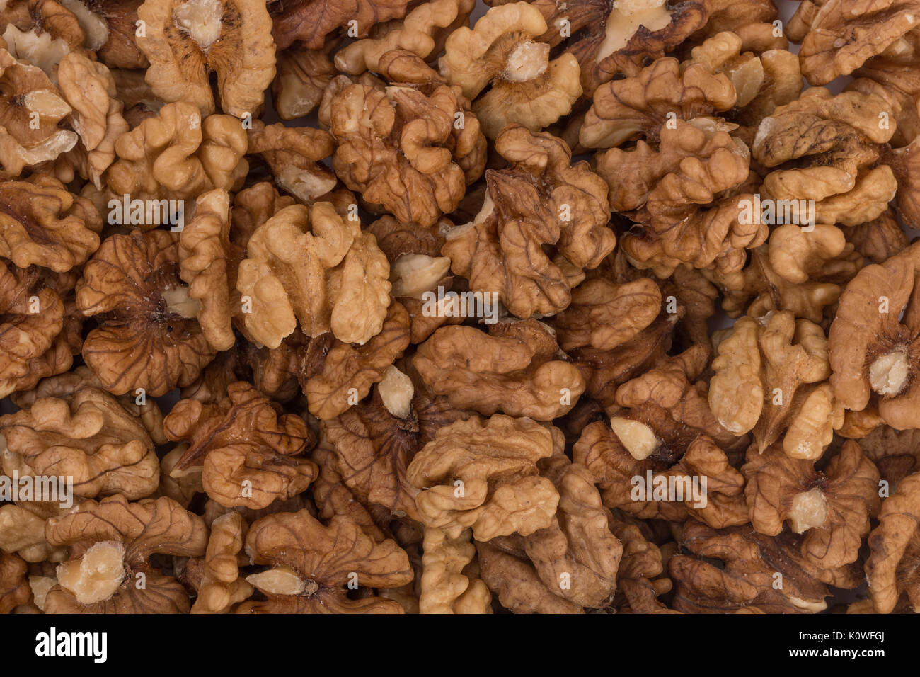 Closeup of big shelled walnuts pile, food background Stock Photo - Alamy