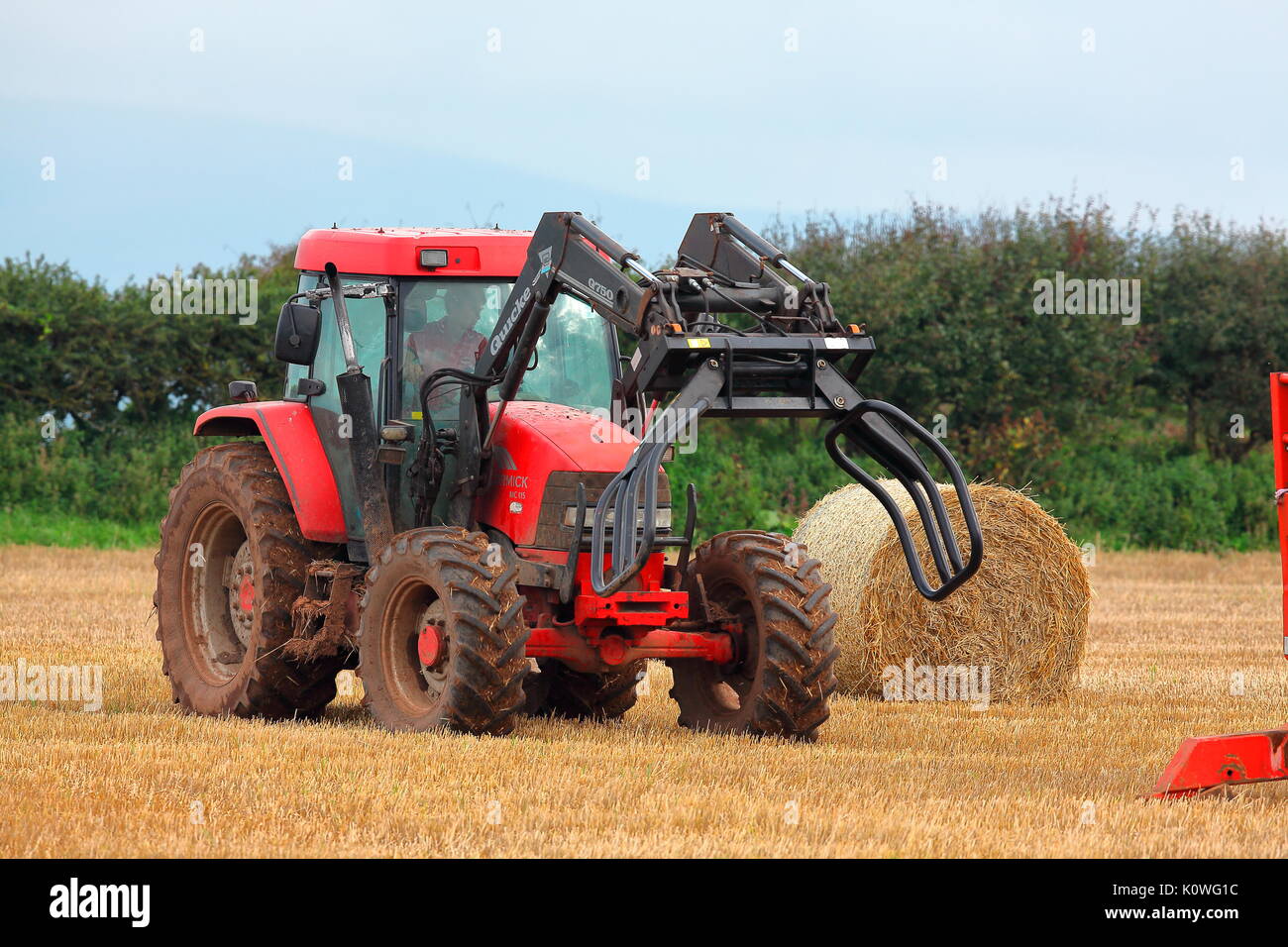 Farmer carrying hay bale hi-res stock photography and images - Alamy