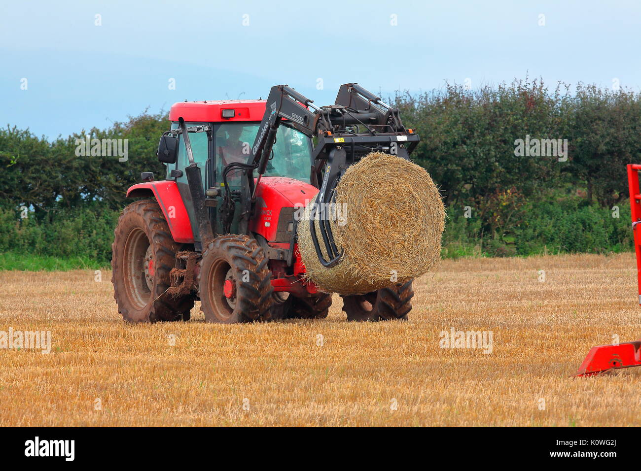 Farmer Carrying Hay Bale High Resolution Stock Photography and Images ...
