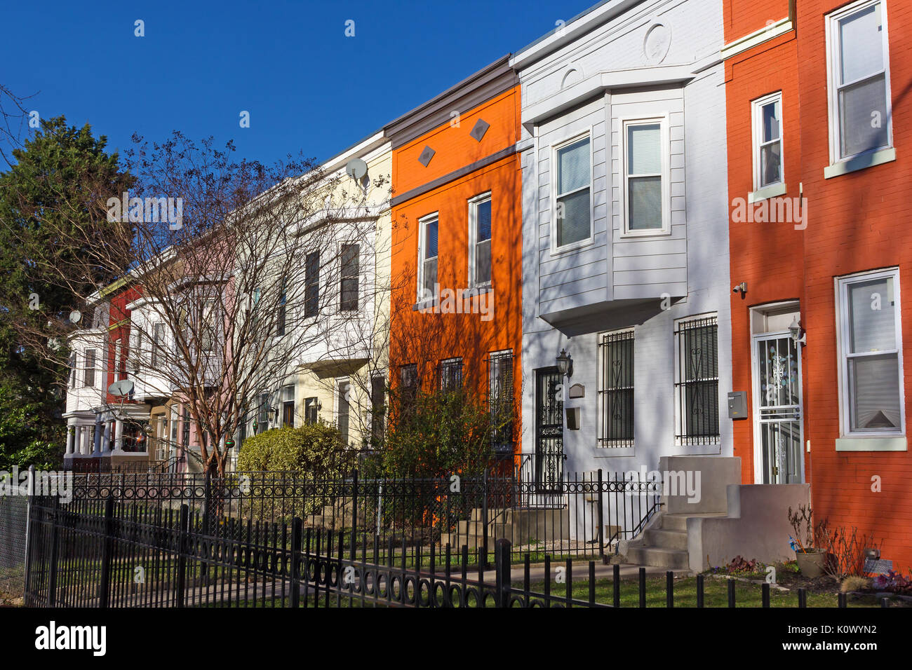 Colorful townhouses under spring sun before sunset, Washington DC, USA ...