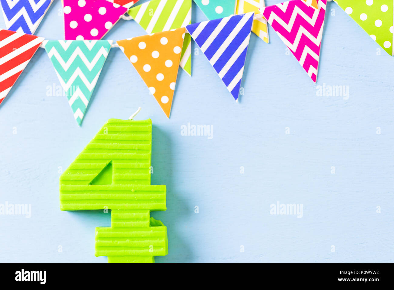 Cake candle in shape of number 4 for Birthday party Stock Photo - Alamy