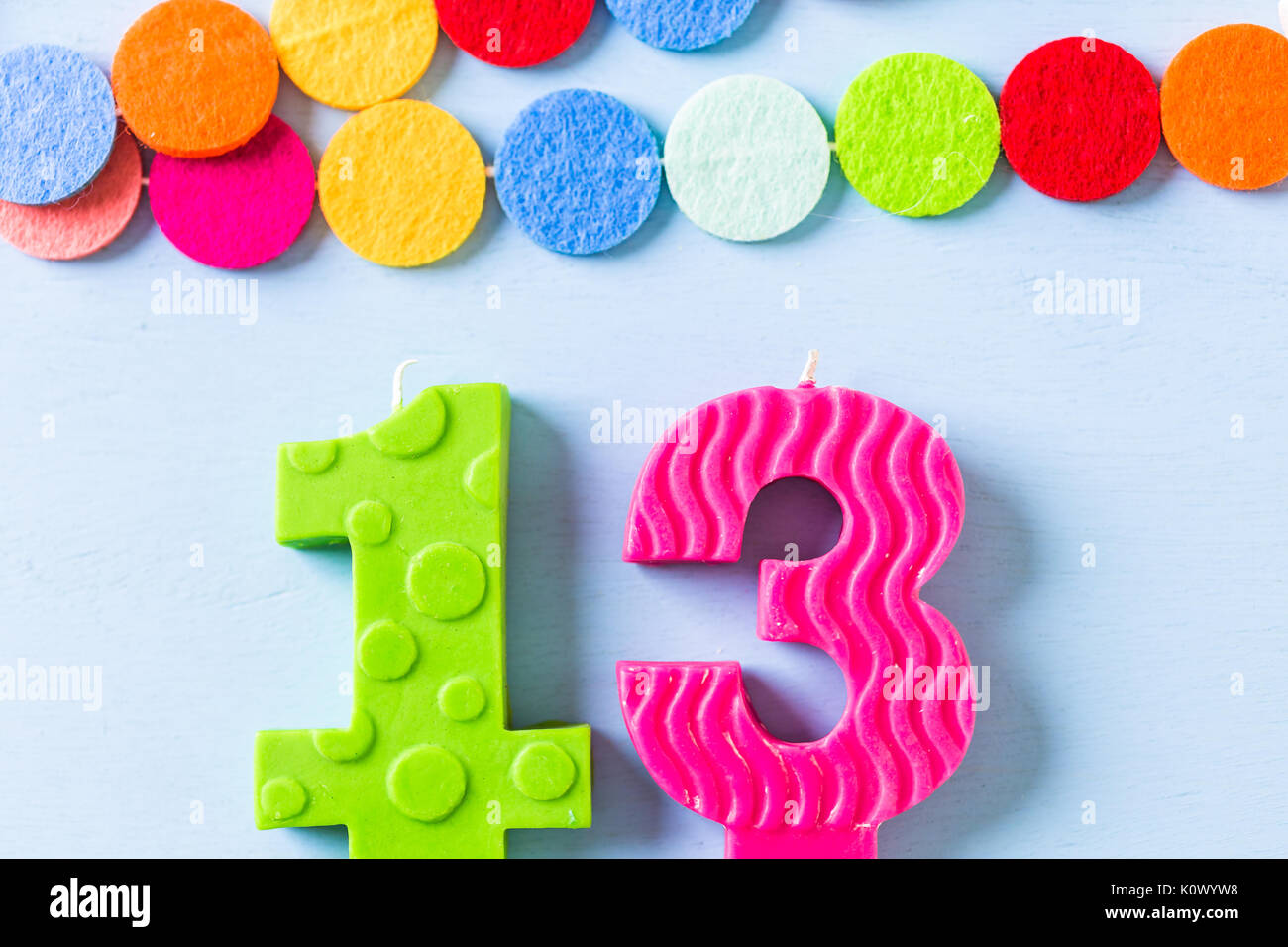 Cake candle in shape of number 13 for Birthday party Stock Photo - Alamy