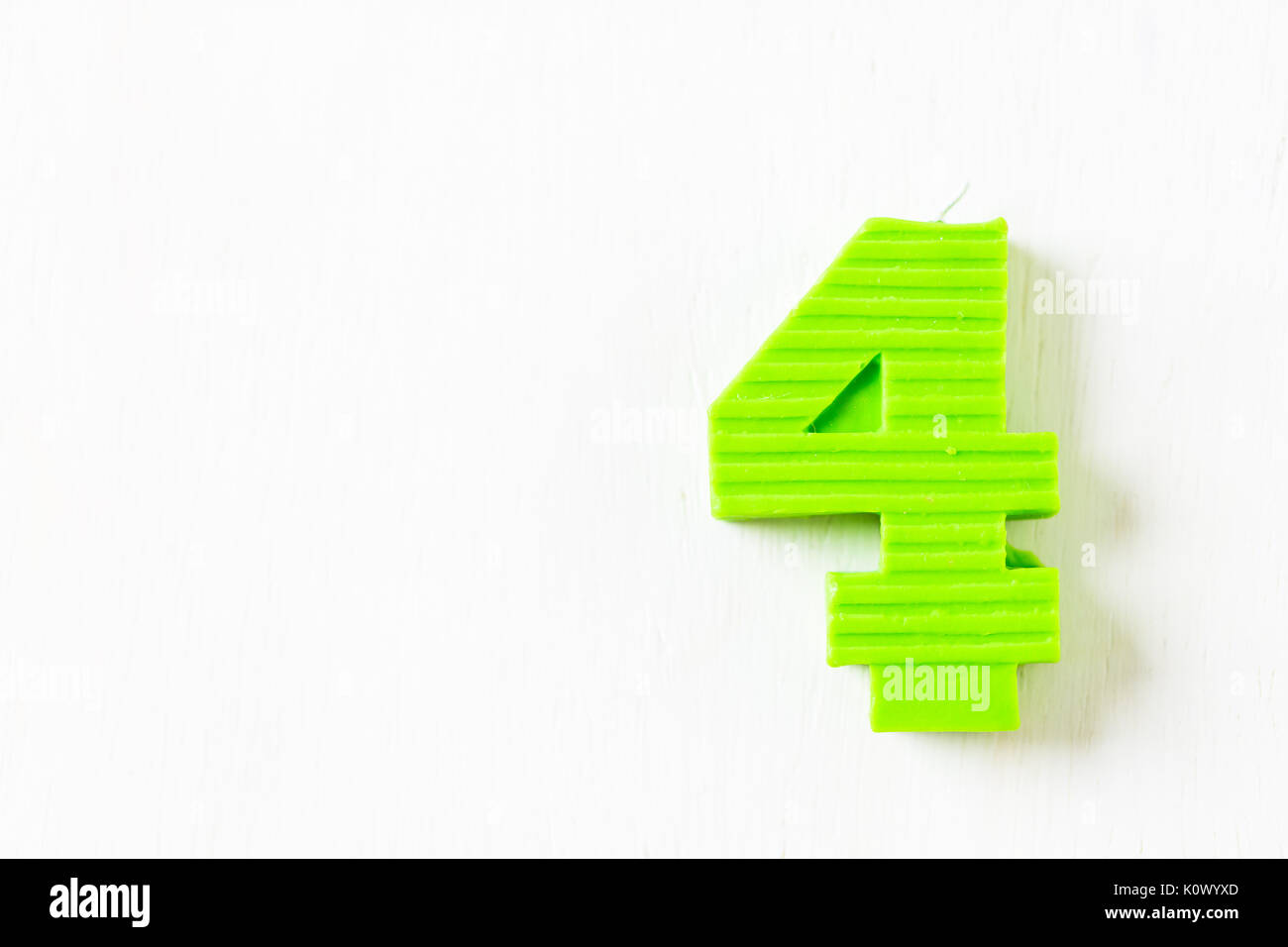 Cake candle in shape of number 4 for Birthday party Stock Photo - Alamy