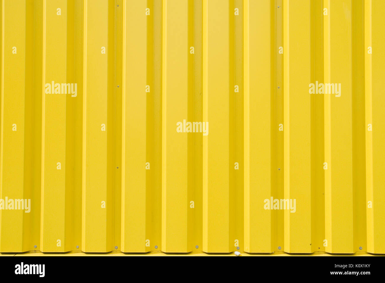 yellow metal covered facade Stock Photo - Alamy