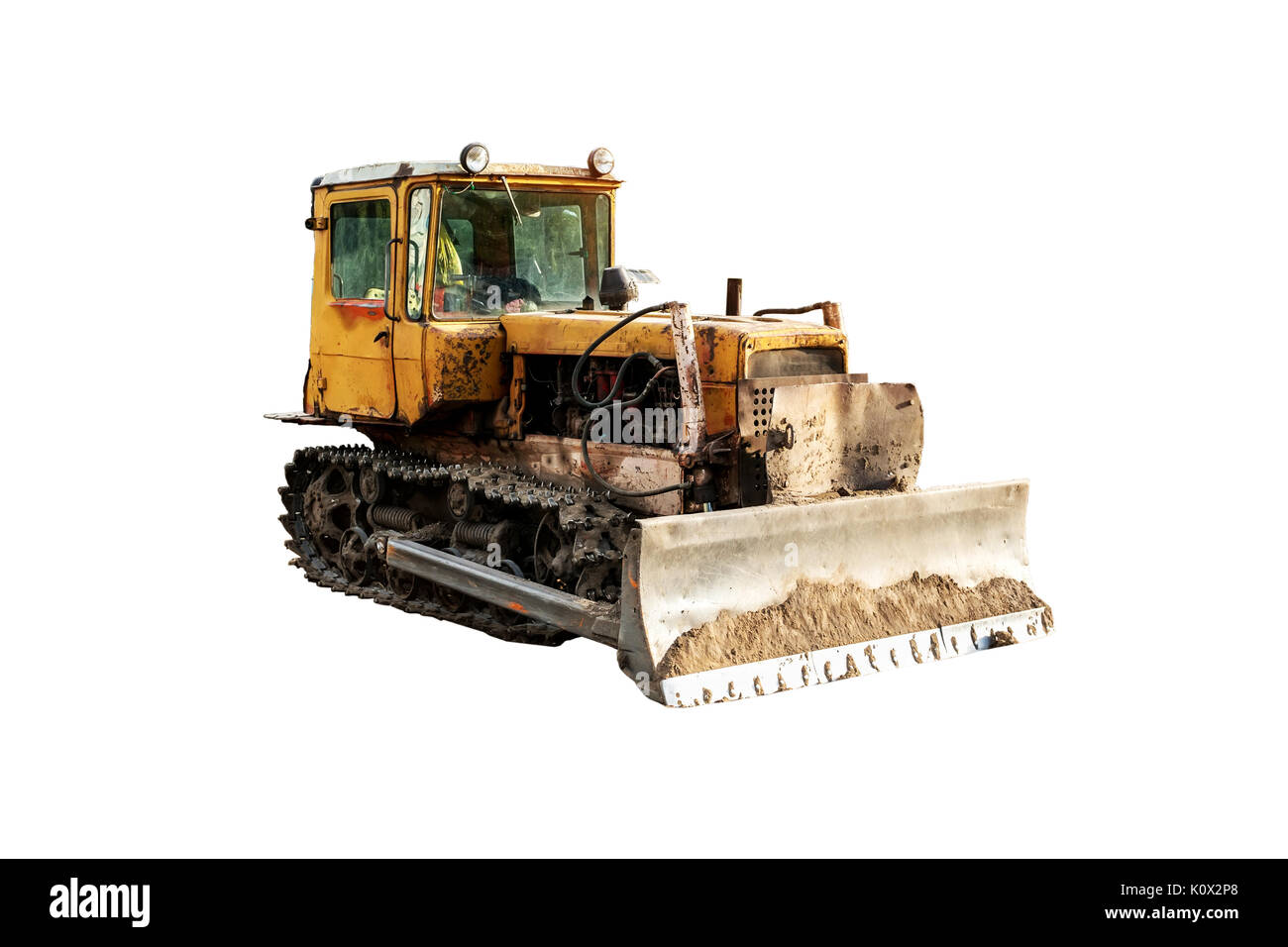 Vintage excavator working on clearing the land isolate on white ...