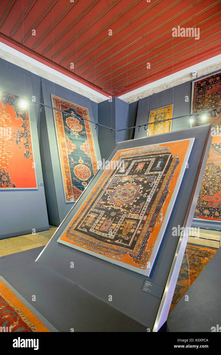 Great Hall of Museum of Islamic Art with old rugs and carpets on ...