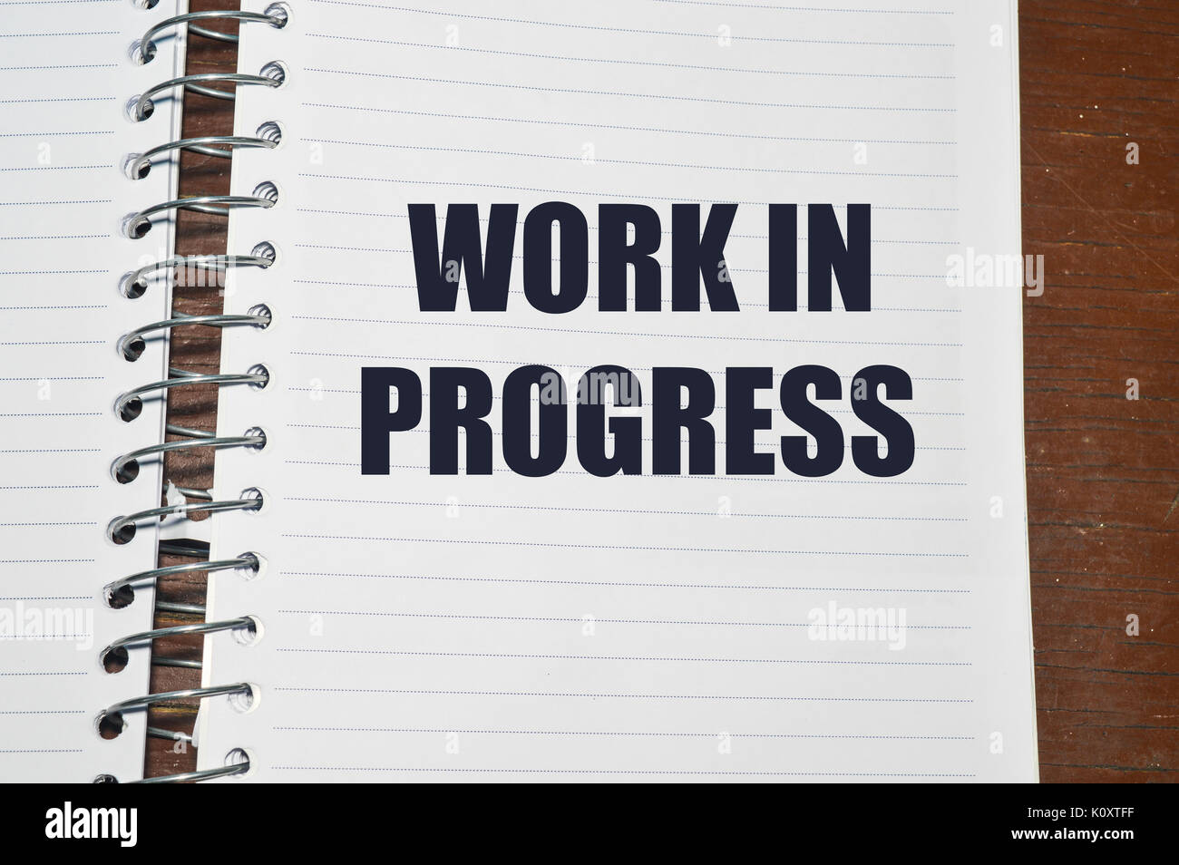 work in progress written on white paper, business concept background ...