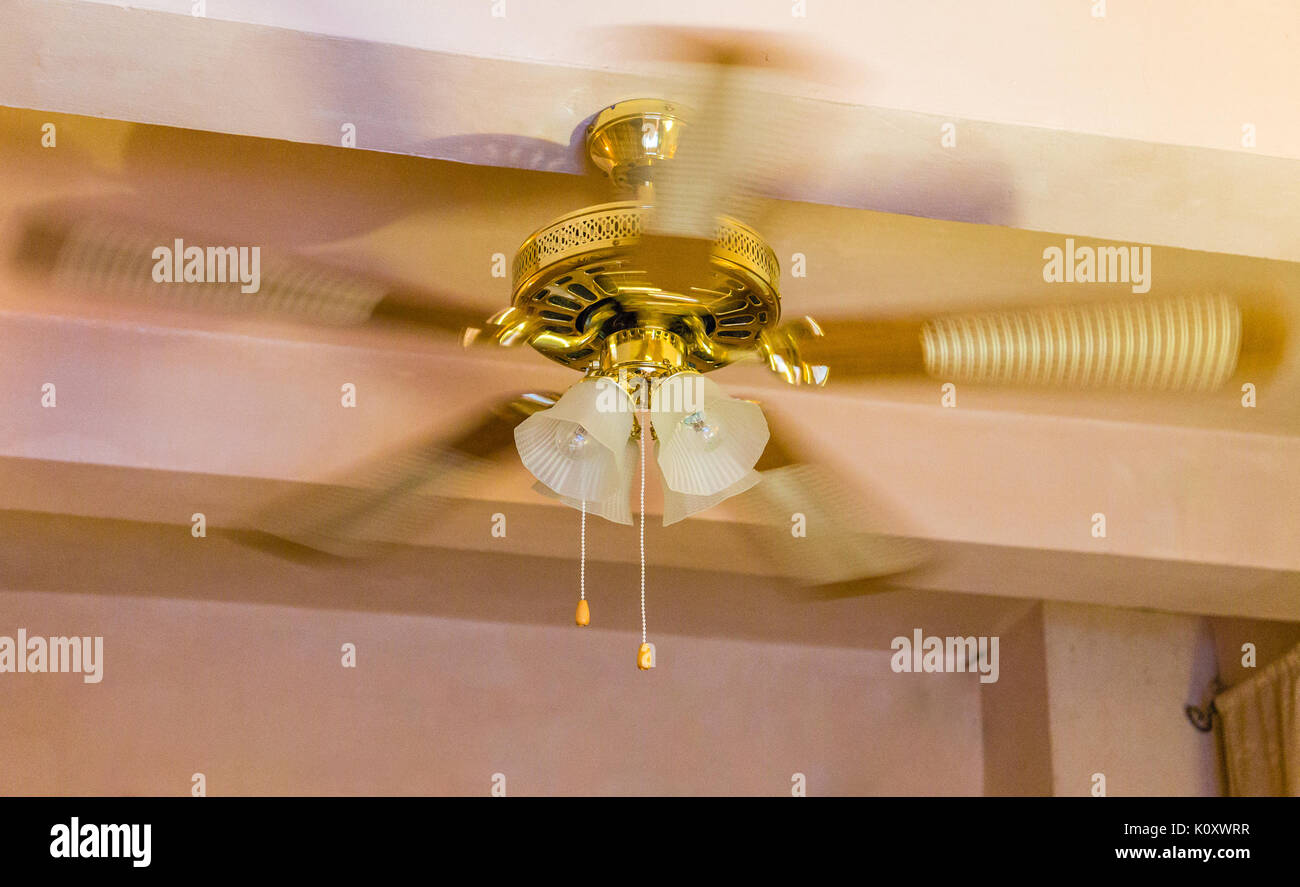 moving blades in ceiling vintage style fan Stock Photo - Alamy