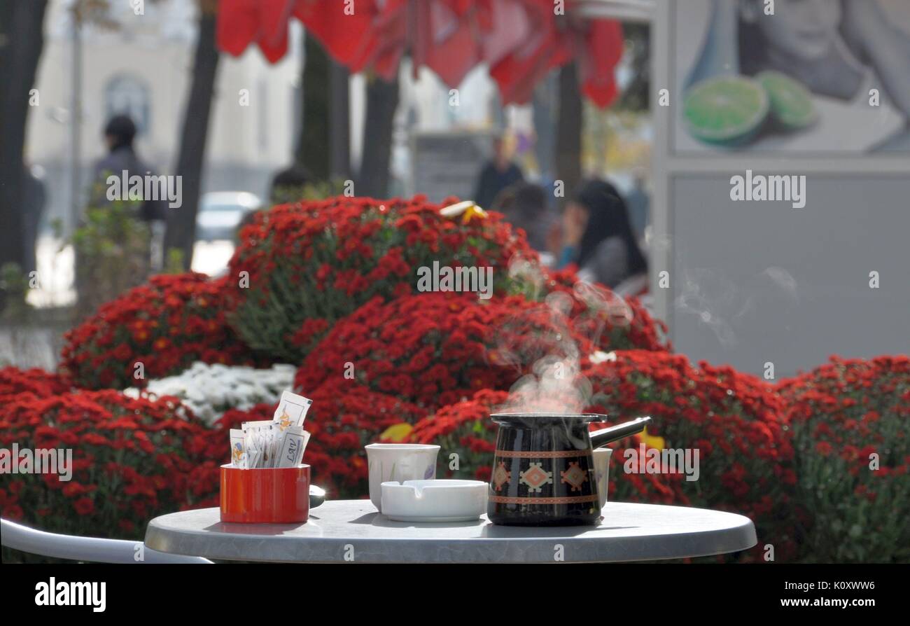 Drinking coffee in cold autumn morning Stock Photo - Alamy