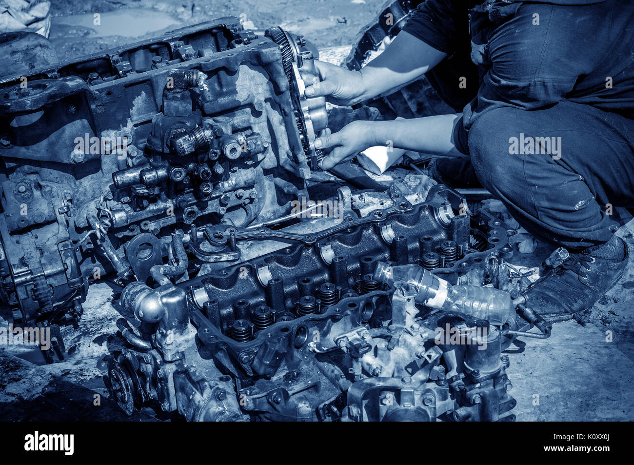 Technicians are repairing and checking the engine Stock Photo - Alamy
