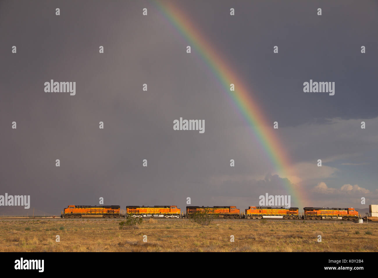 An American freight train with a rainbow in the background Stock Photo - Alamy