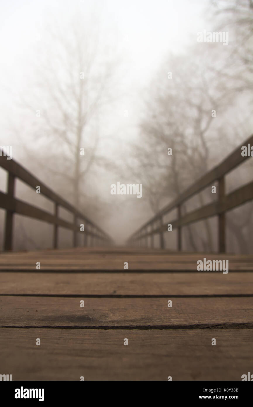 Wooden bridge in fog Stock Photo - Alamy