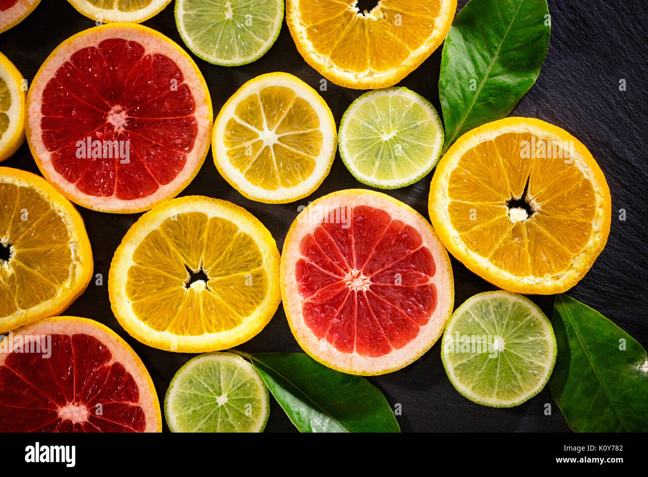 juicy fruit background from various slices of citrus close-up Stock ...