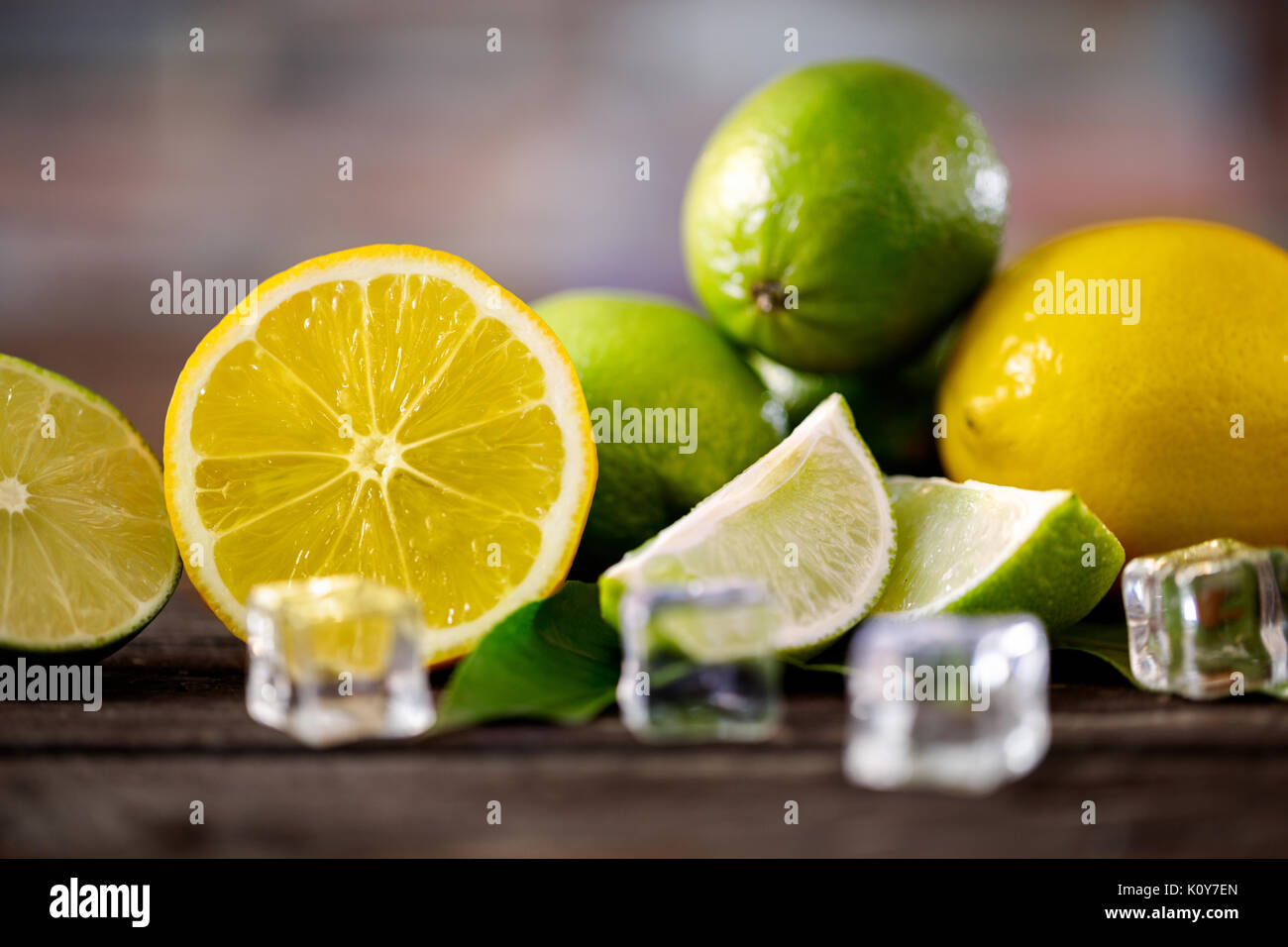 raw sliced lemons and lime summer freshness fruits background Stock ...