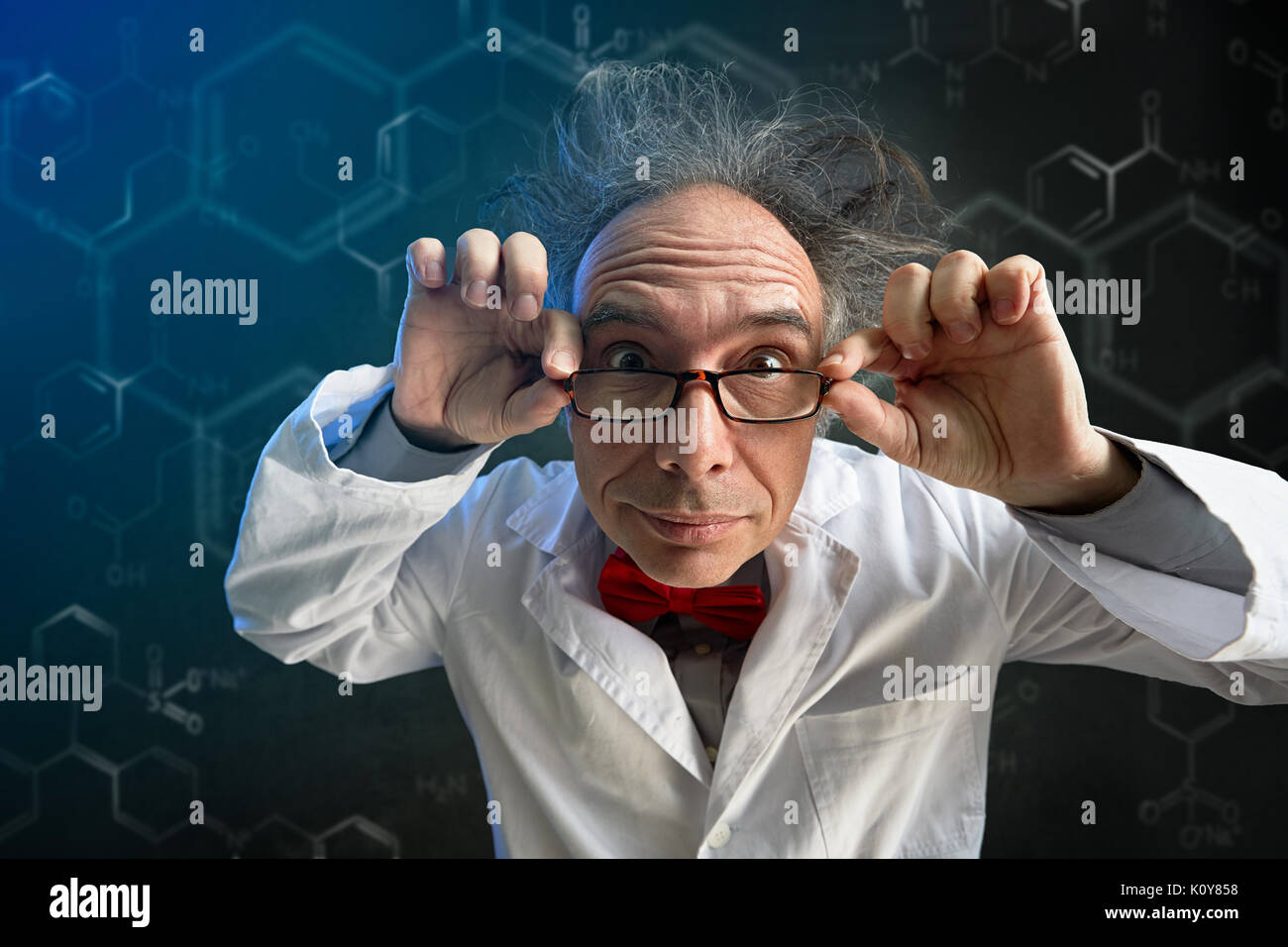crazy scientist looking thought glasses in camera Stock Photo - Alamy