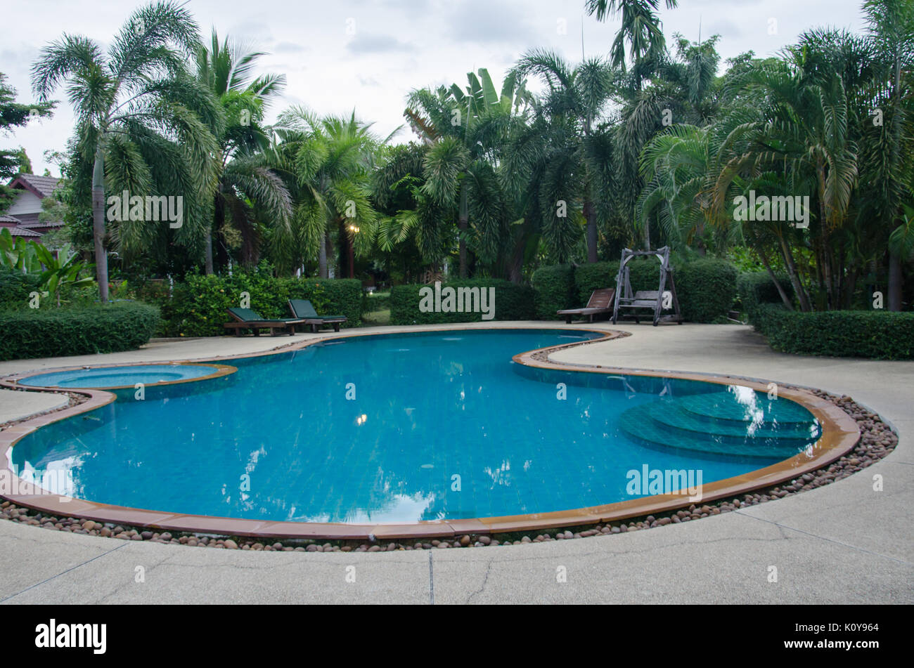 Beautiful luxury swimming pool in hotel resort Stock Photo - Alamy
