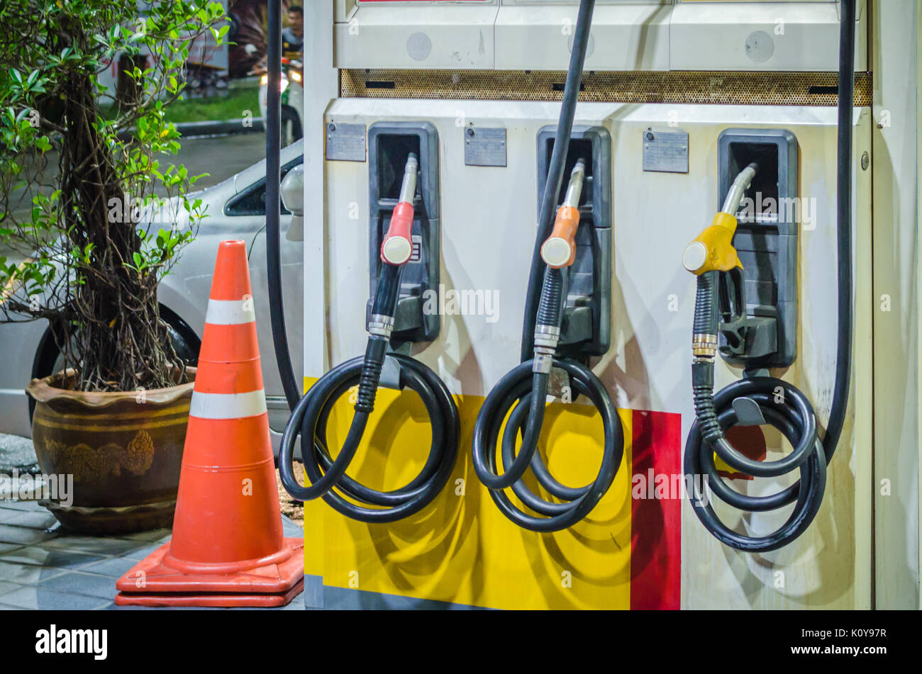 line of gasoline pump nozzles Stock Photo - Alamy