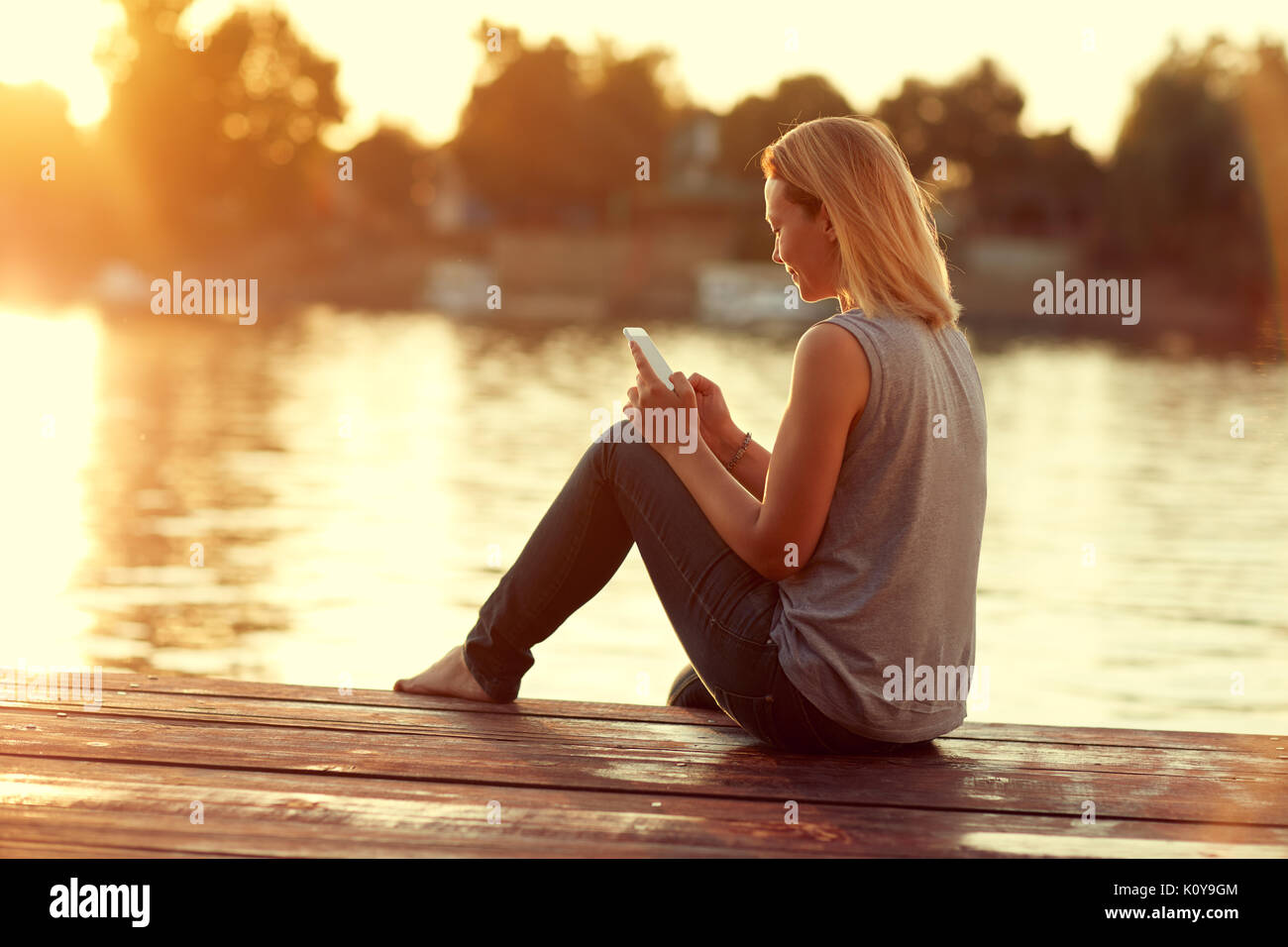A Girl Sitting Alone In The Sunrise