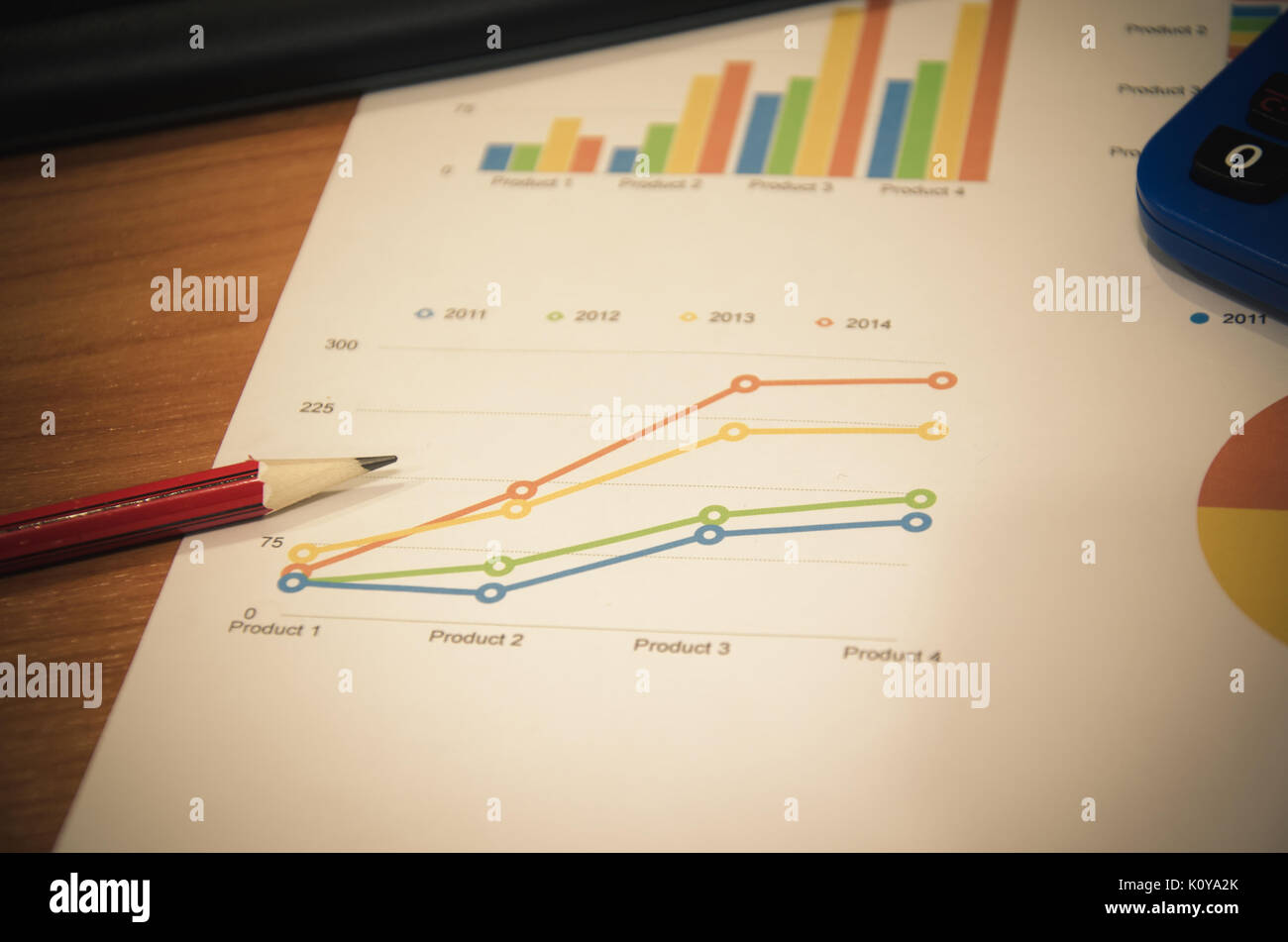 business documents with charts growth, computer and pen. workplace ...