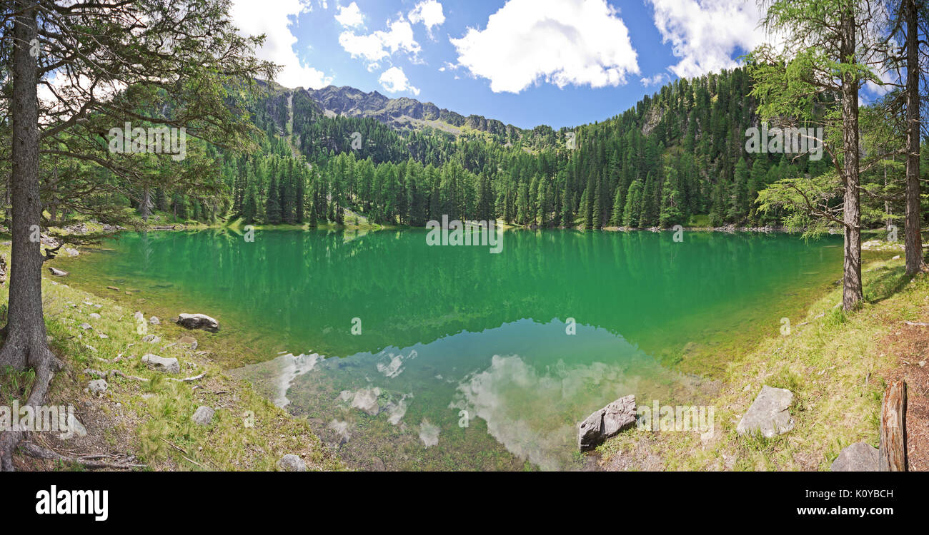 A beautiful secluded mountain lake with turquoise crystal clear water ...