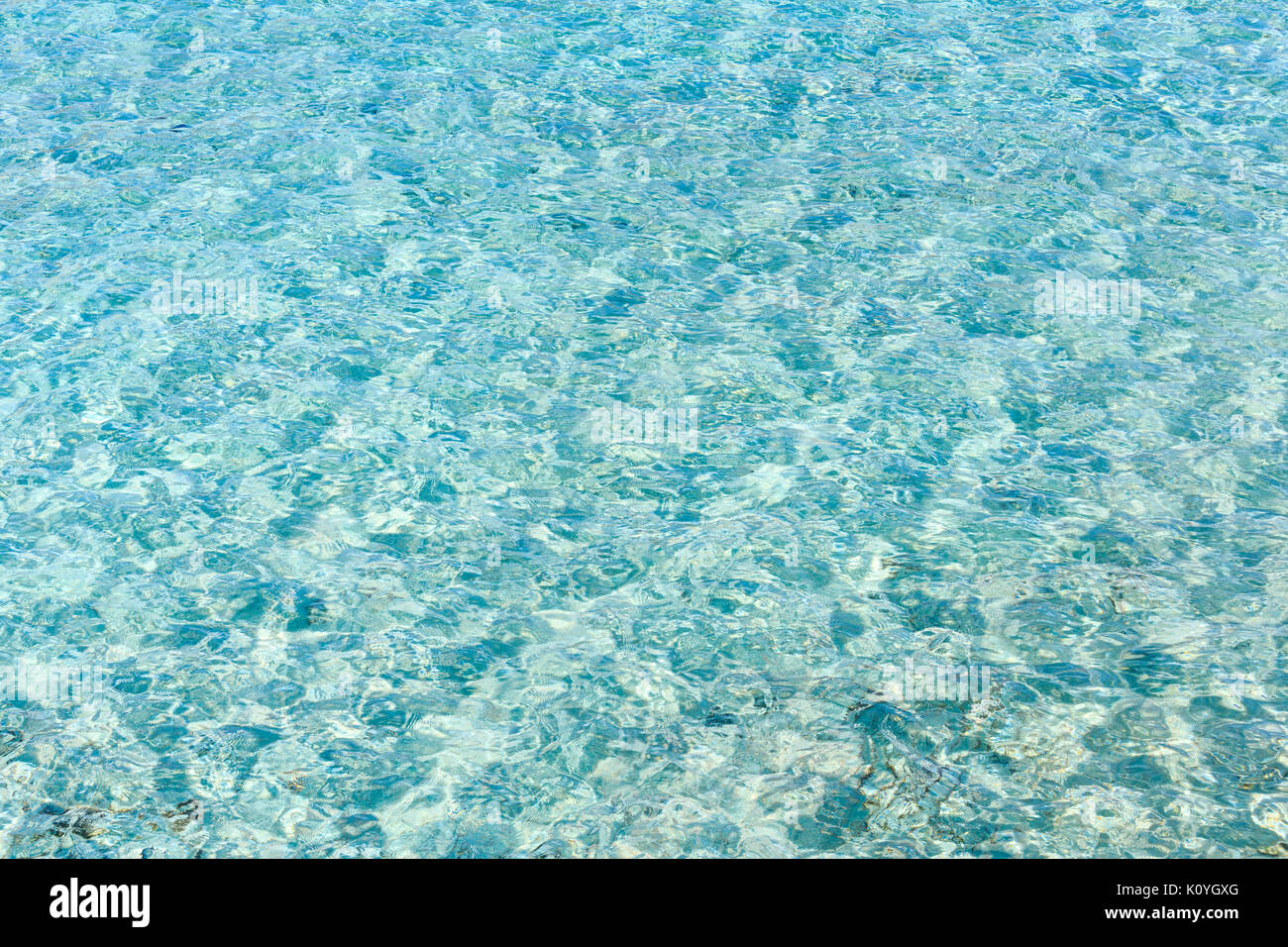 Blue sea flowing water surface with waves and sun glitters. Abstract ...