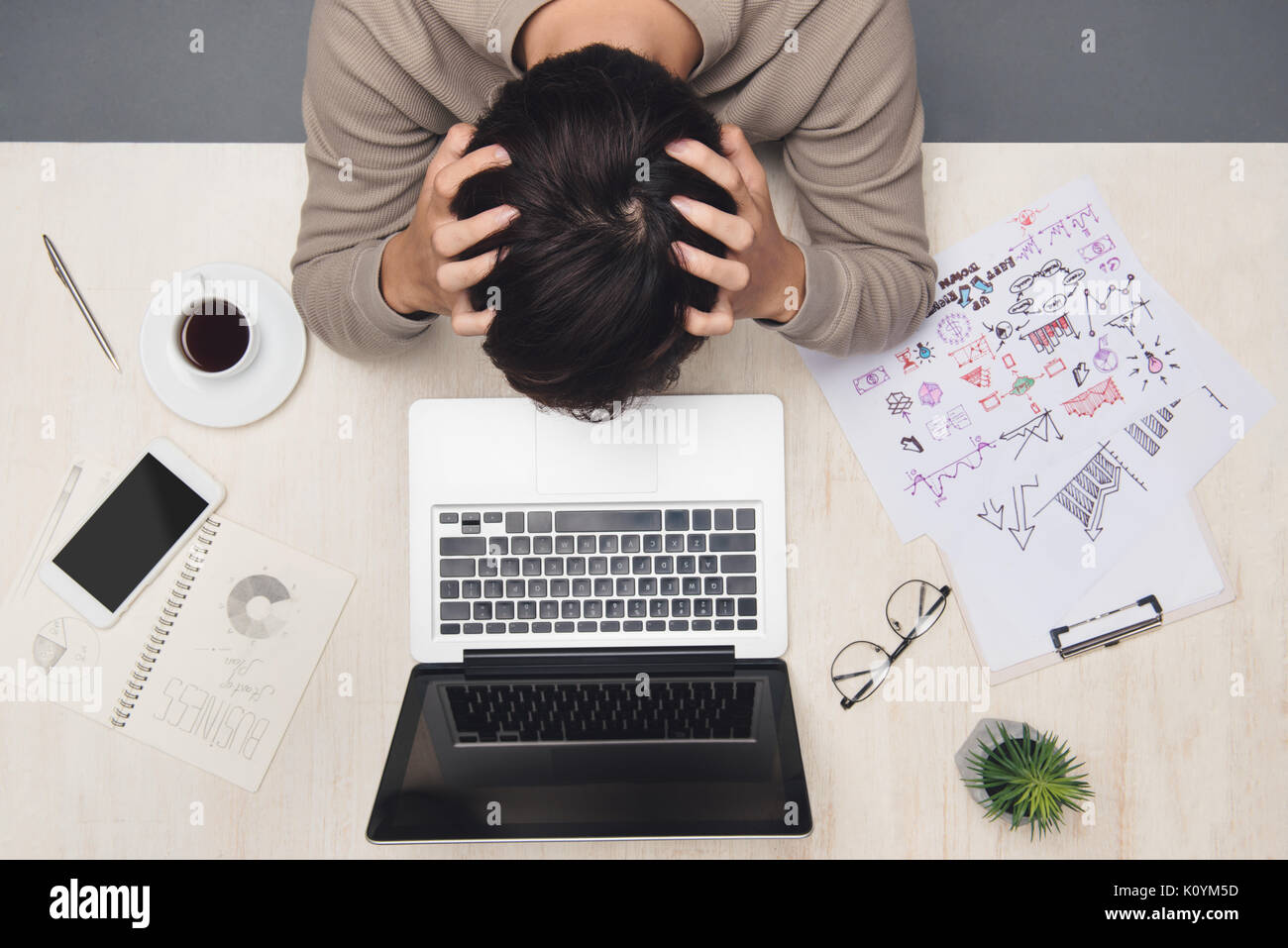 Stressed businessman working on desk at workplace Stock Photo - Alamy