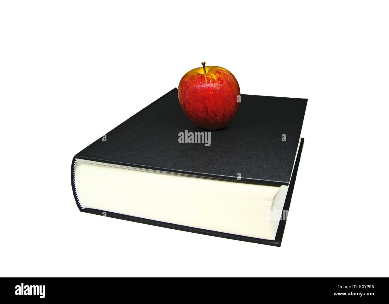 Red apple on top of black hard-cover dictionary book isolated on white ...