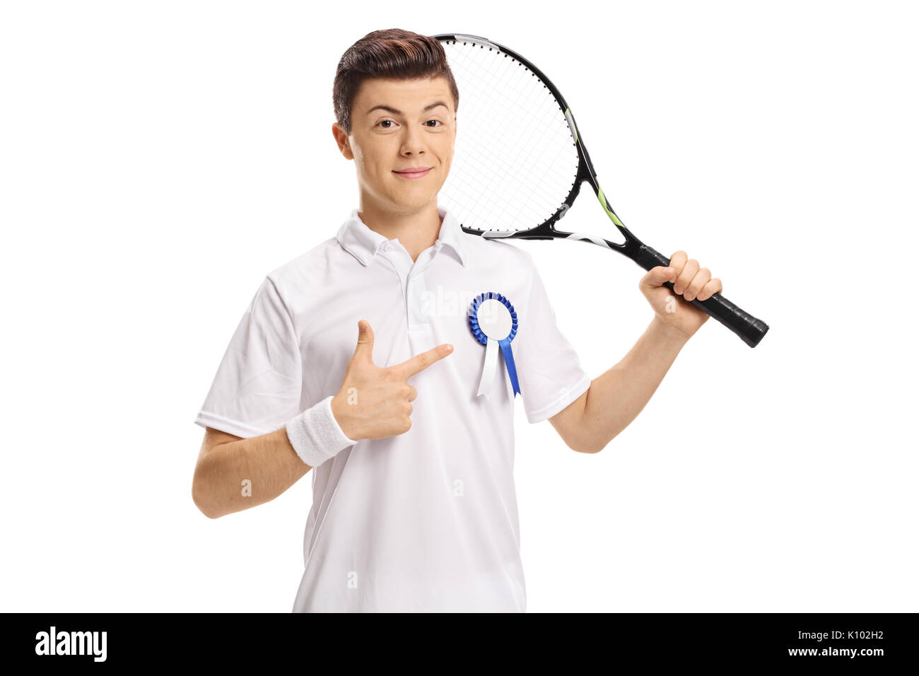 Teenage tennis player with an award ribbon pointing isolated on white ...